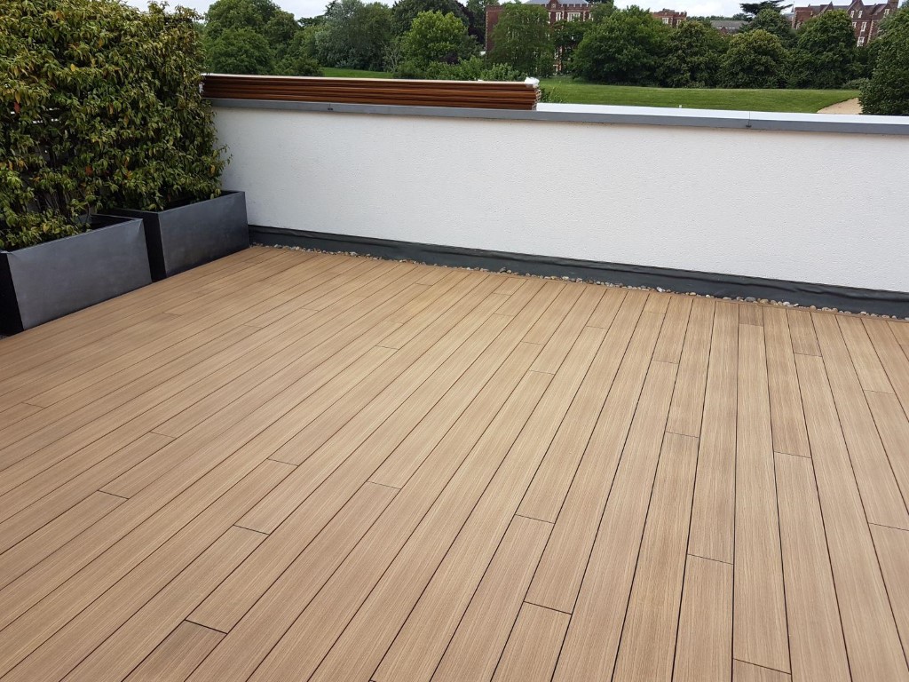 An image of Teak decking tiles - Wallbarn