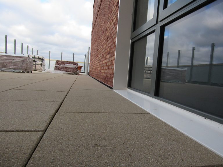 Universal pedestals for paving and decking - paved terrace up to door ...